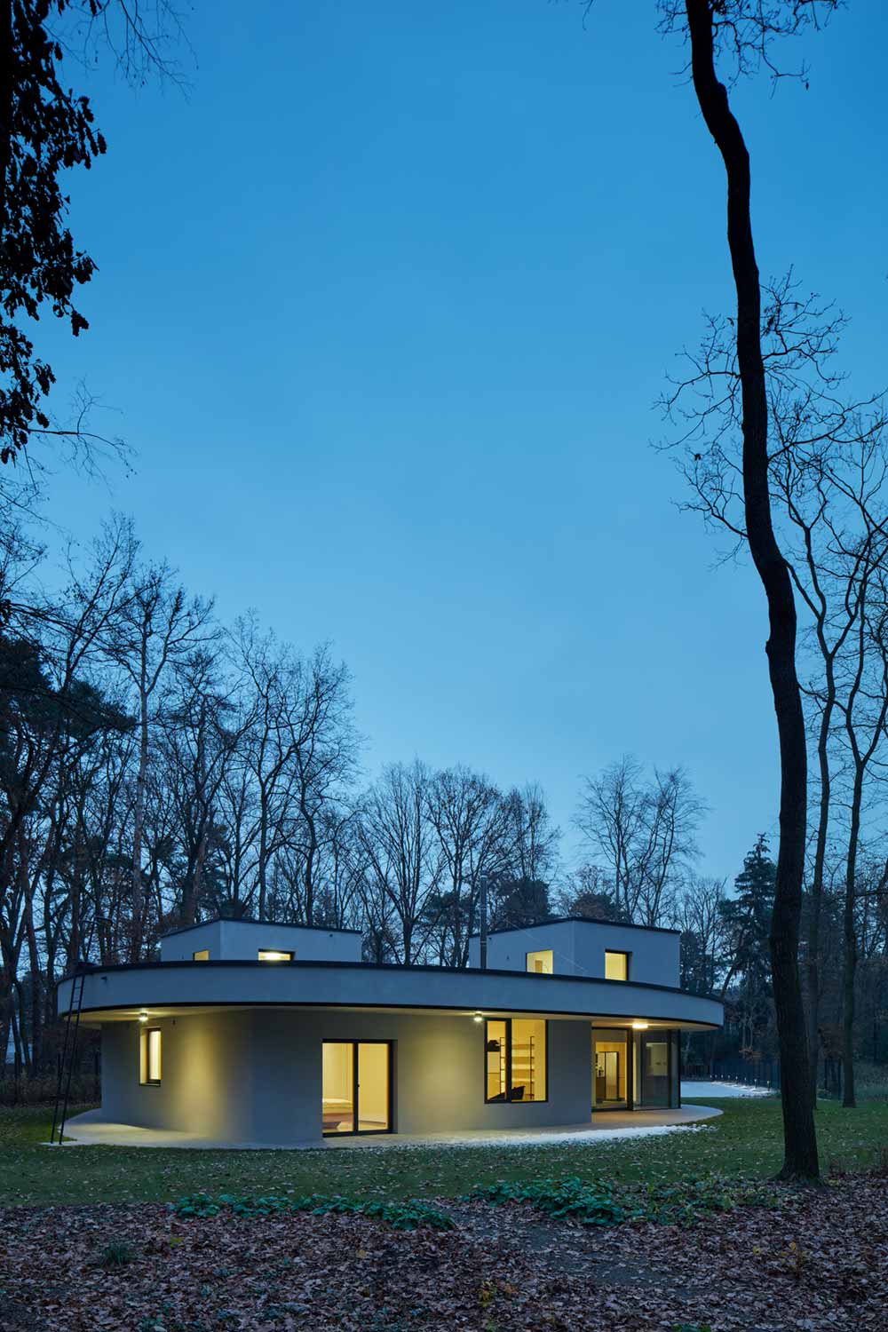 Modern Forest Villa with Curved Roof Outside Prague, Czech Republic