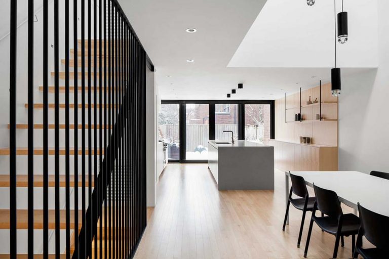 Row House Renovated With Modern Interiors and Triple Height Space