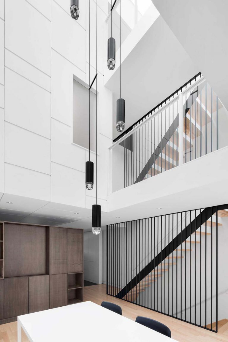 Row House Renovated With Modern Interiors and Triple Height Space